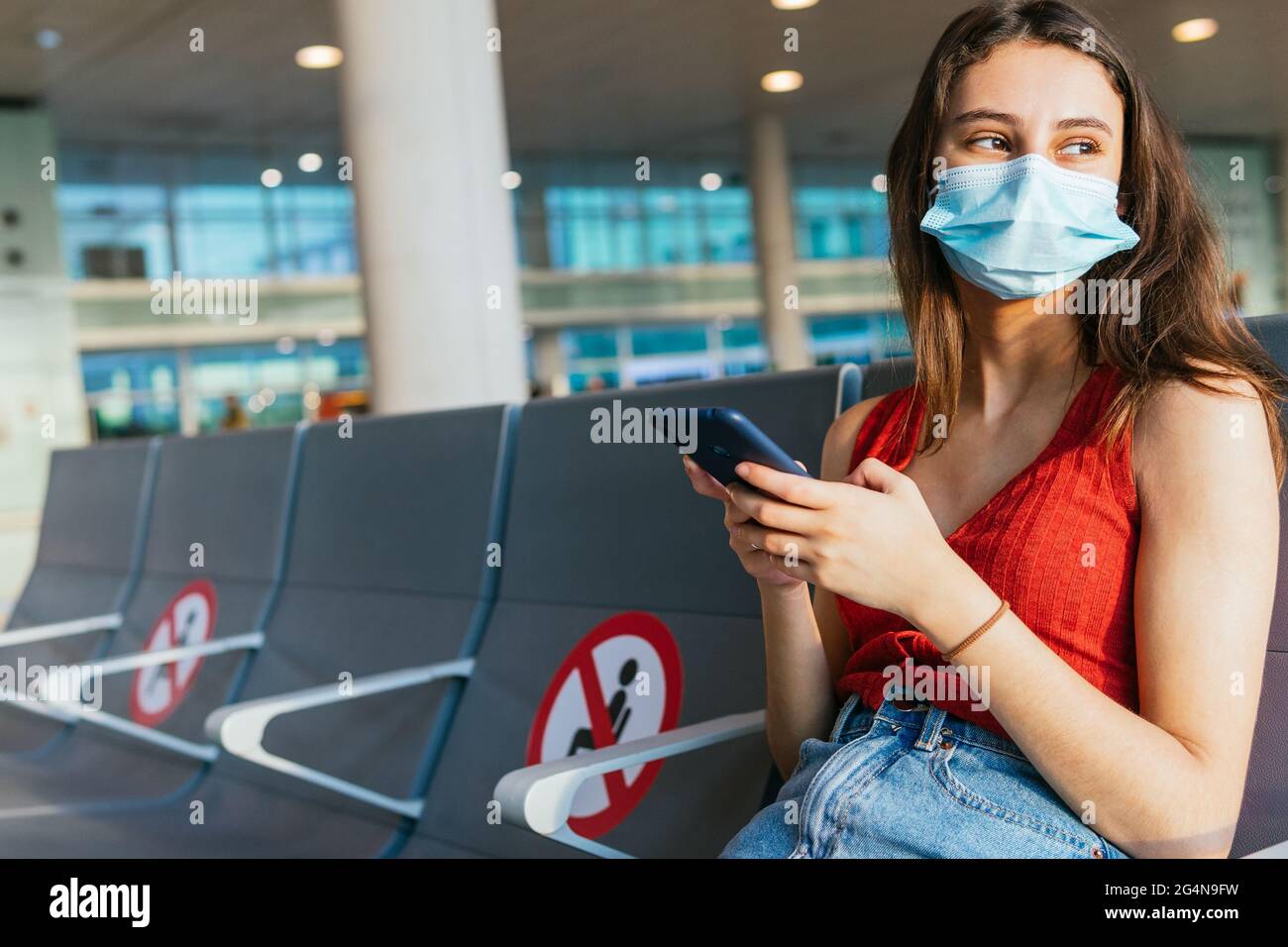Back view of ethnic female reflecting in mirror praying with closed ...