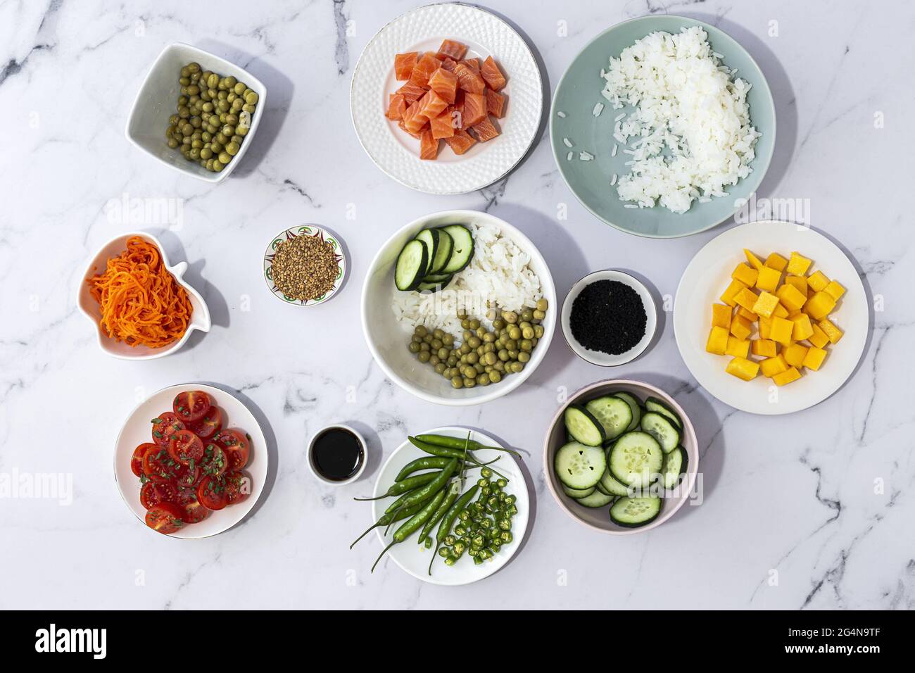 Top view of assorted fresh ingredients for traditional oriental poke ...