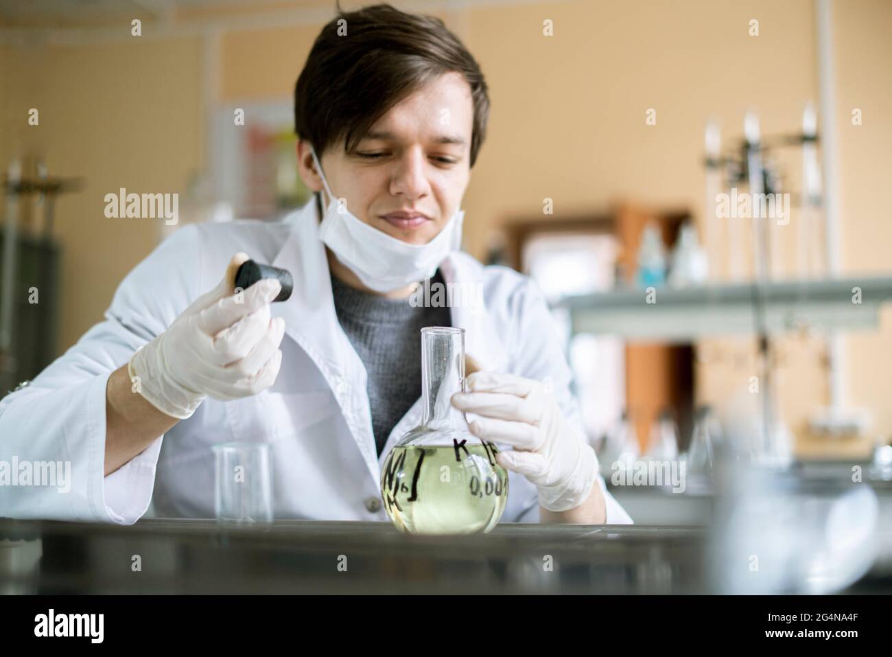 Chemistry class student doing experiment hi-res stock photography and ...