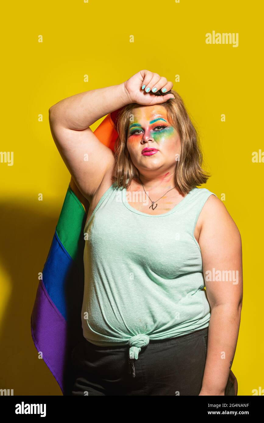 Full body attractive cheerful female in maxi sundress standing barefoot ...