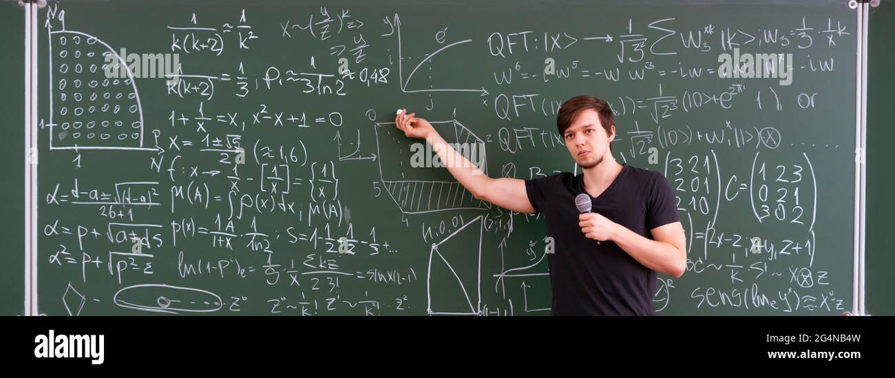 teacher of young professor explains the law of physics for students on ...