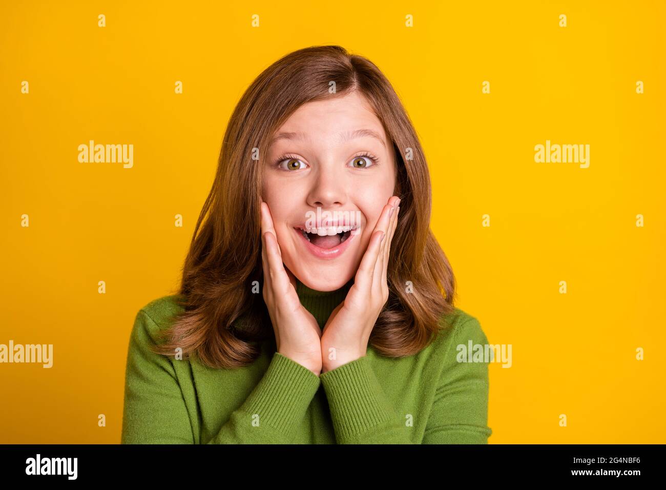 Photo portrait smilingamazed touching cheeks in casual outfit happy ...