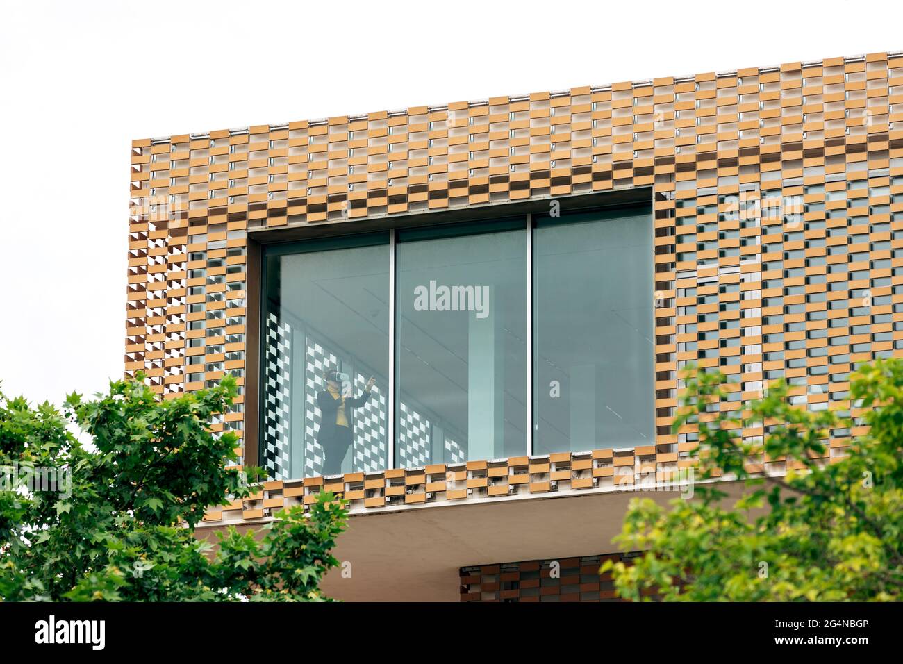 From below through window view of female in stylish outfit in VR ...
