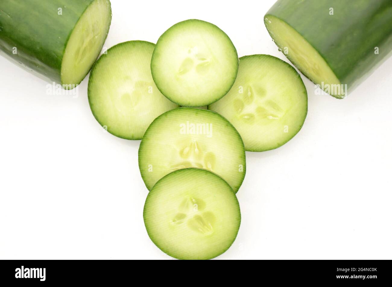 Sliced green ripe cucumber isolated on white background Stock Photo - Alamy