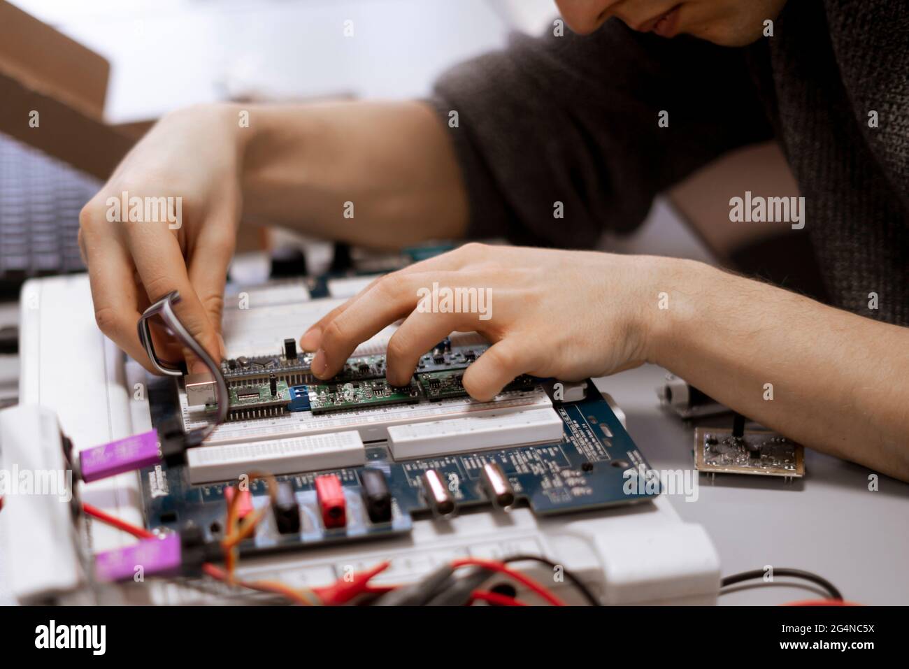 student making measurement and costruct the circuit board with engineer ...