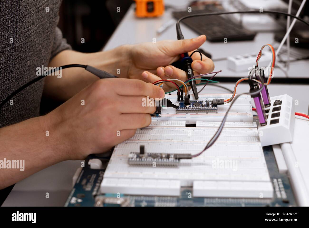 student making measurement and costruct the circuit board with engineer ...