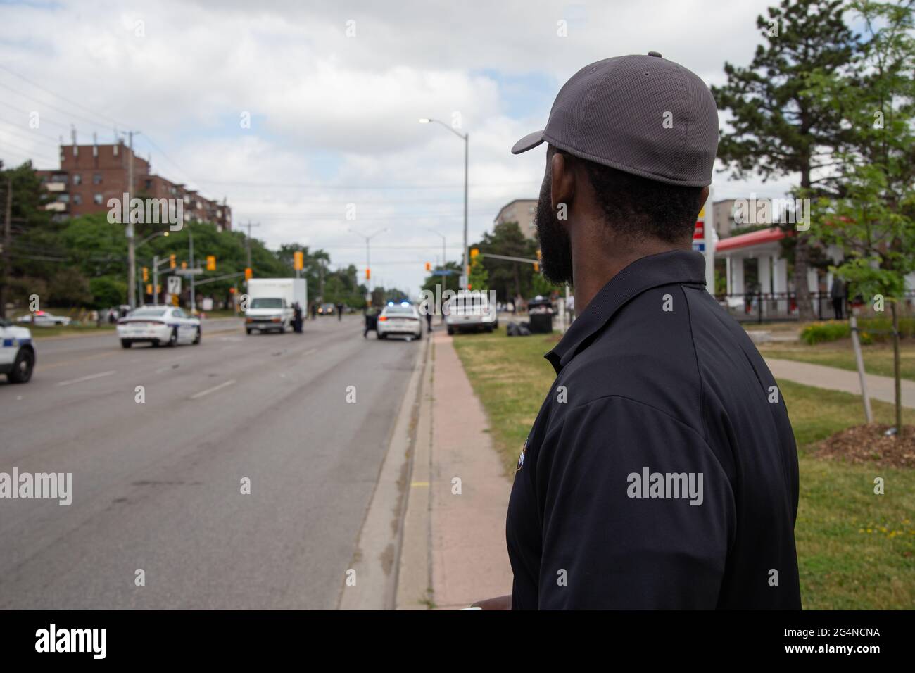 Closeup shot of a security guard in a uniform patrolling the ...