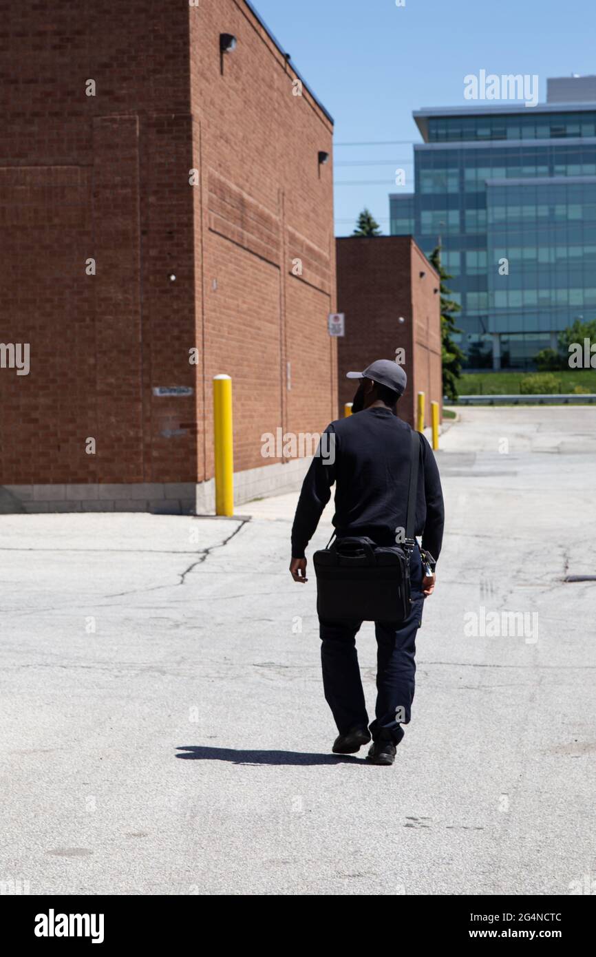 Vertical shot of a security guard watching over the parking area Stock ...