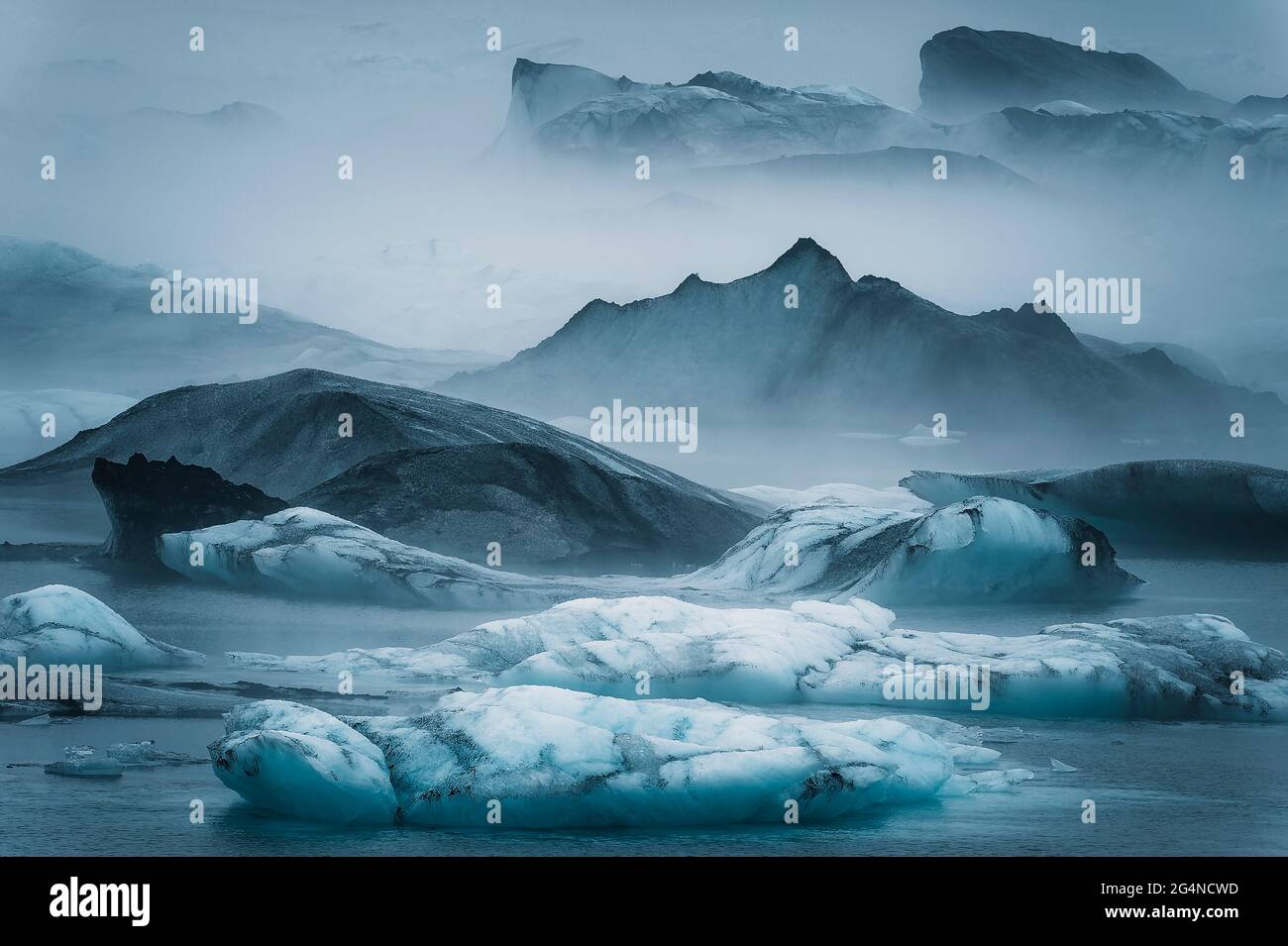 Ice bergs floating in water Stock Photo - Alamy