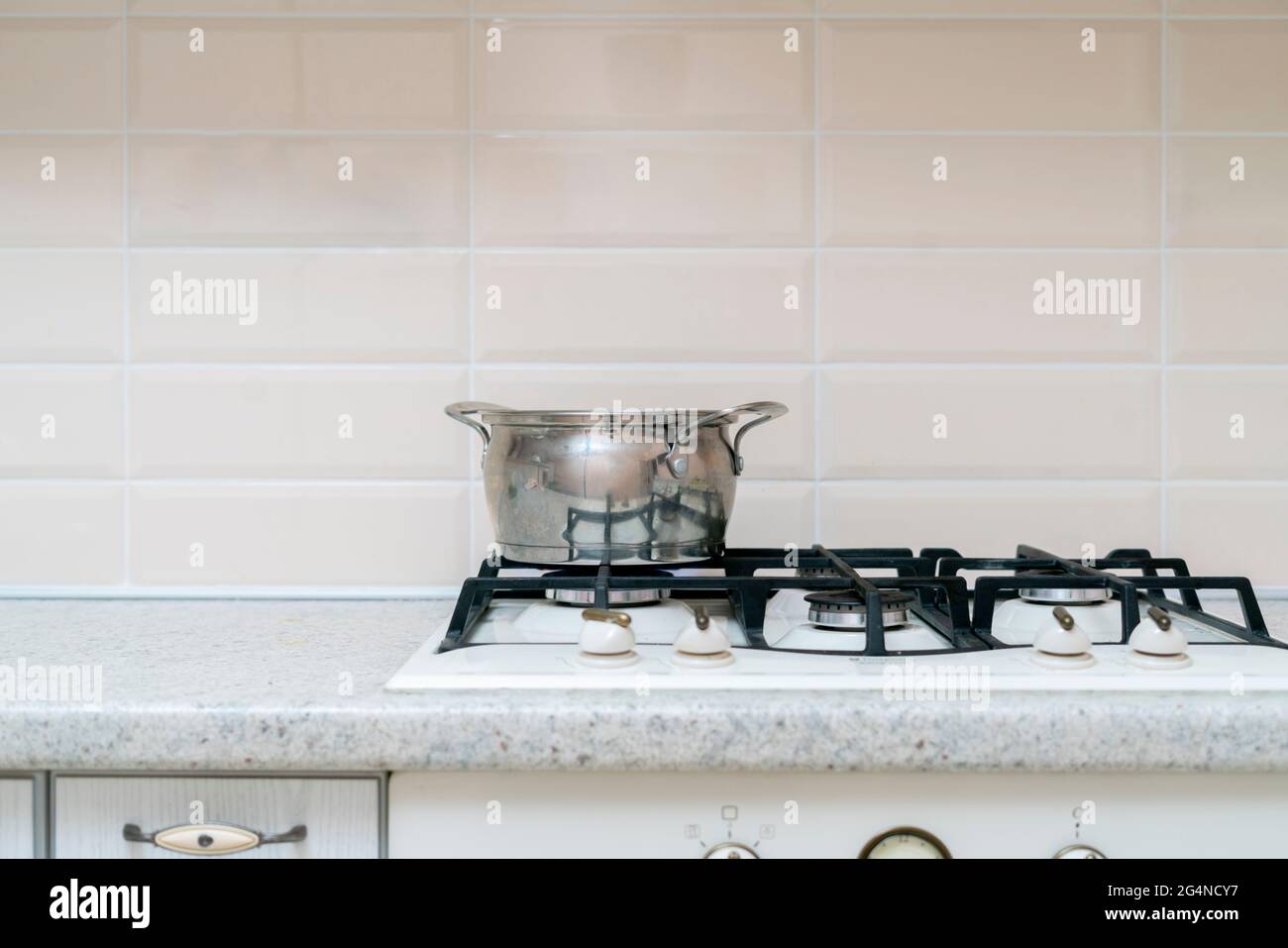 a simple single pot with boiling water while cooking at home on the ...
