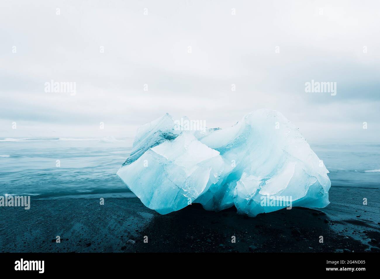 Ice block lying on beach Stock Photo - Alamy
