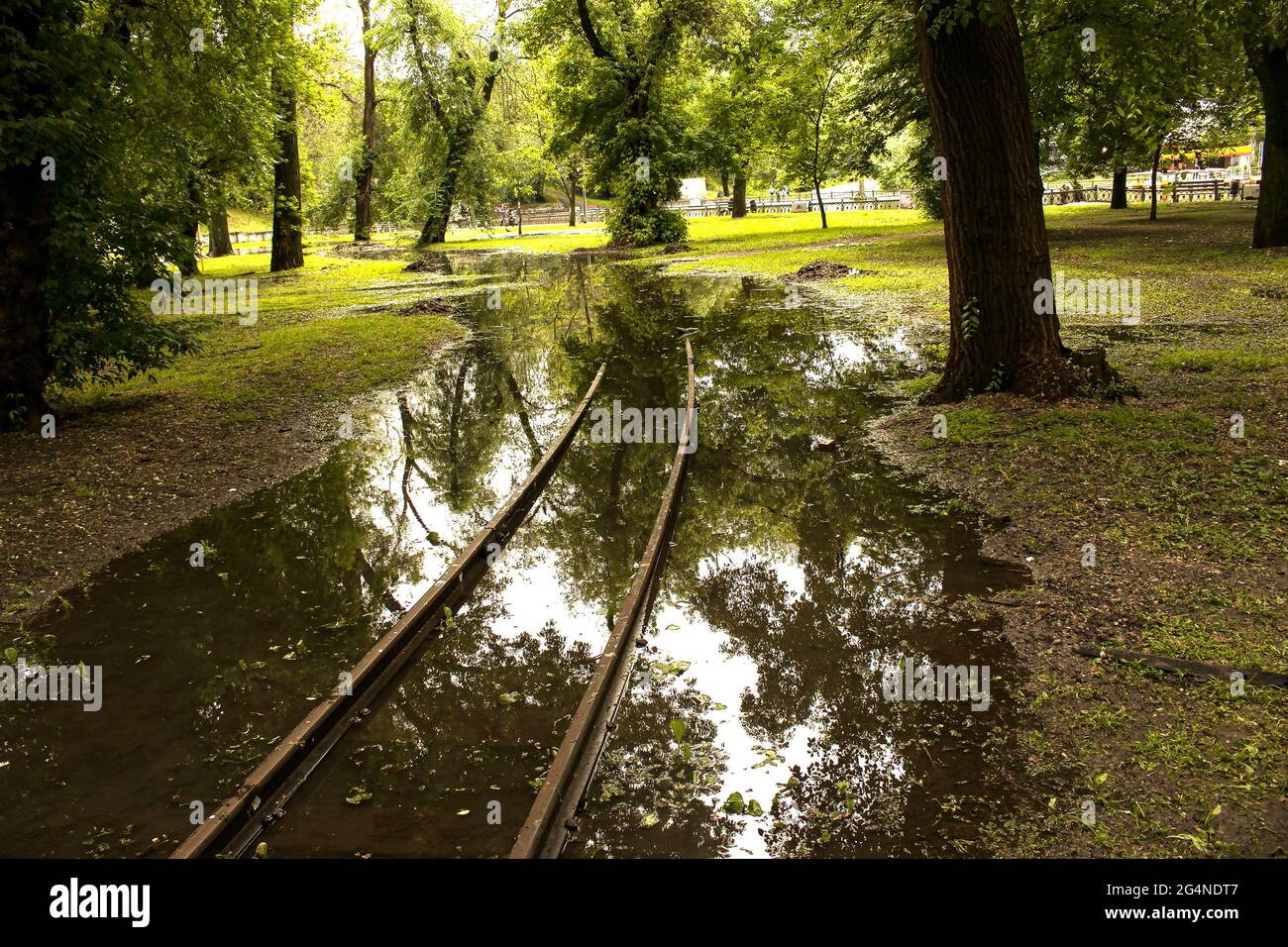 Public park drenched in rain. Water logged park.Wet benches. Park ...