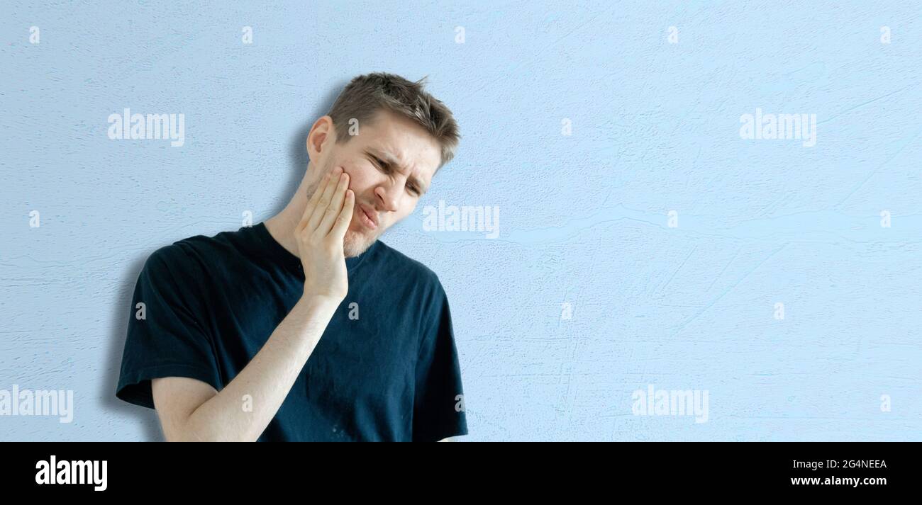 a simple copy space minimal concept of the toothache, male fortrait ...