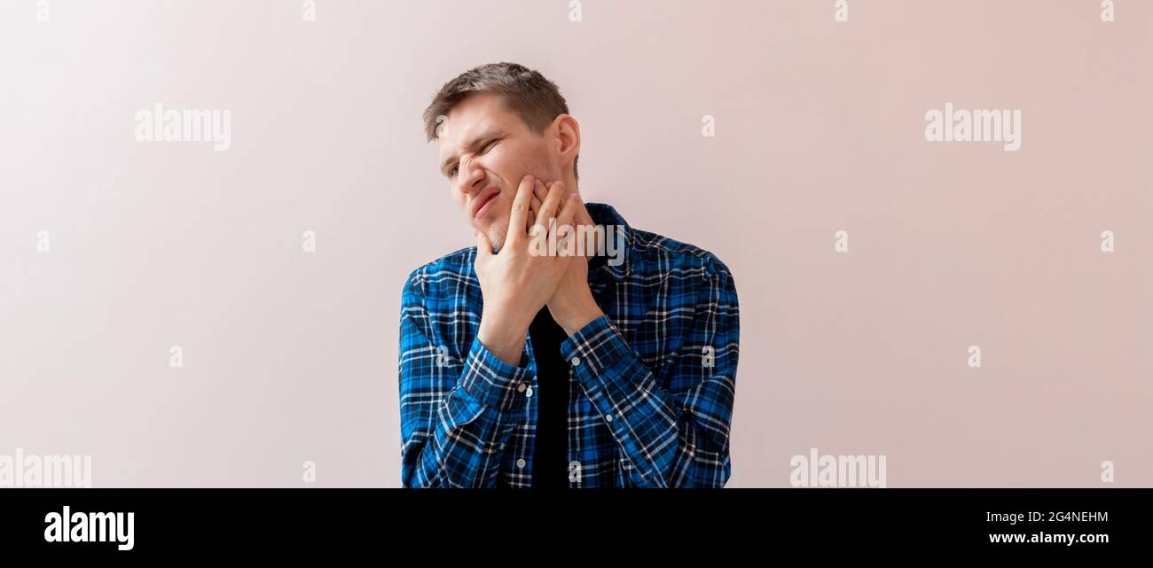 a simple copy space minimal concept of the toothache, male fortrait ...