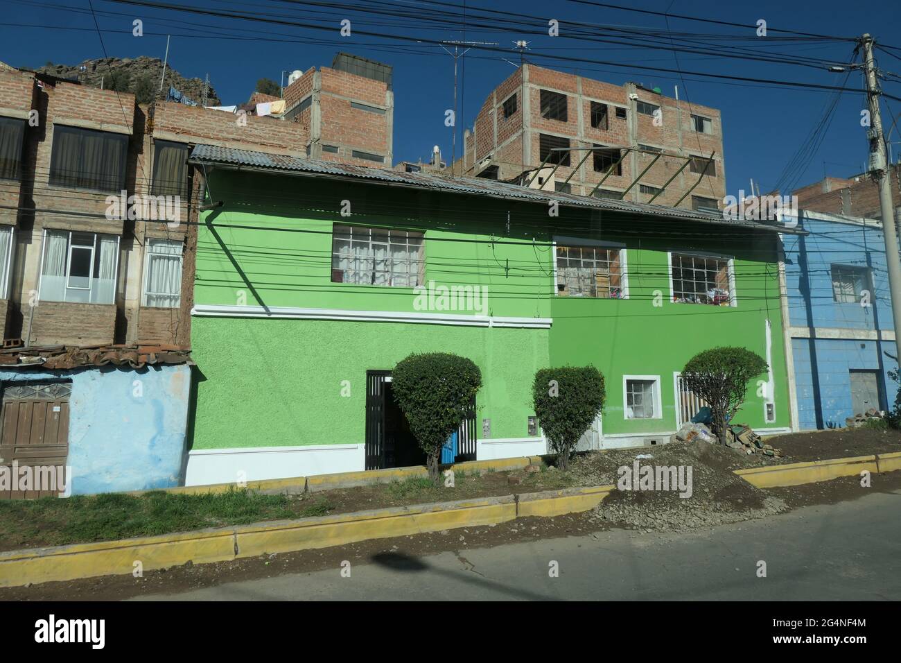 Green house in town in Peru Stock Photo - Alamy