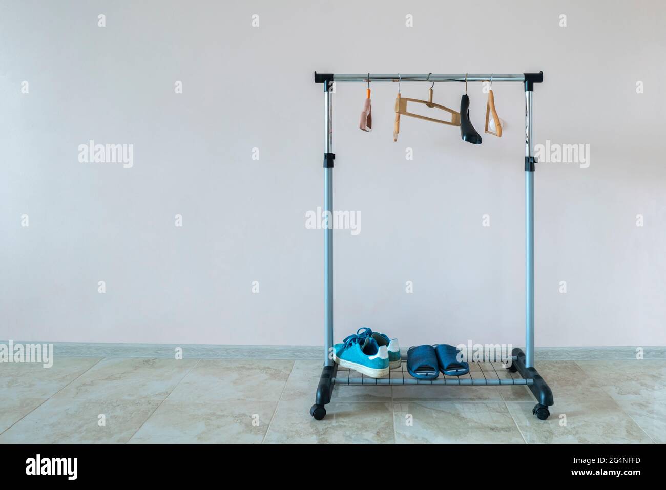 simple empty rail wheel hanger stand near the wall at the hotel Stock ...