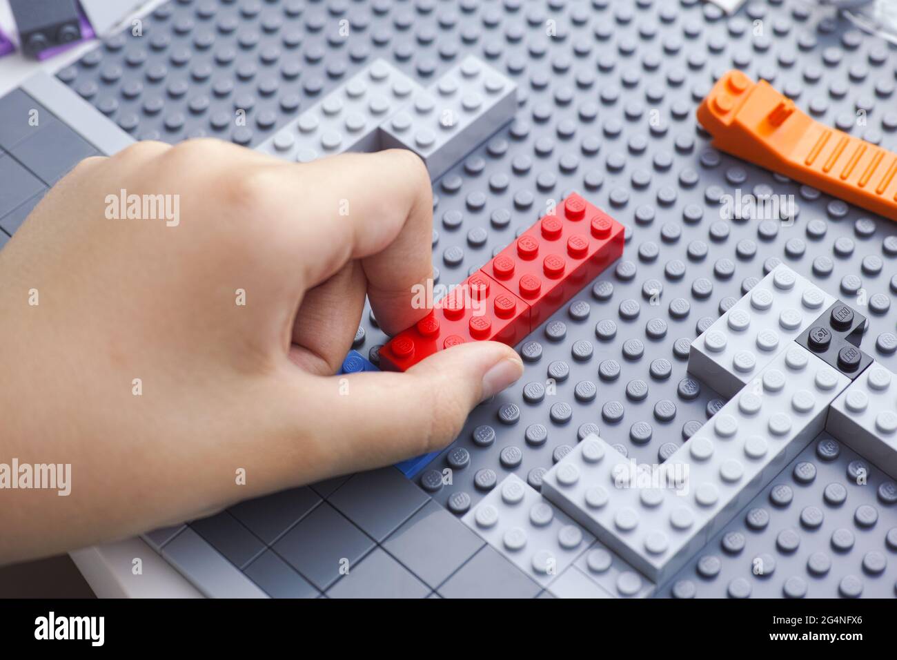 Tambov, Russian Federation - June 21, 2021 A child building a Lego set ...