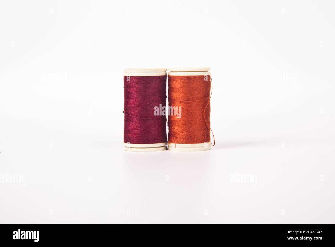 Orange threadspools hi-res stock photography and images - Alamy