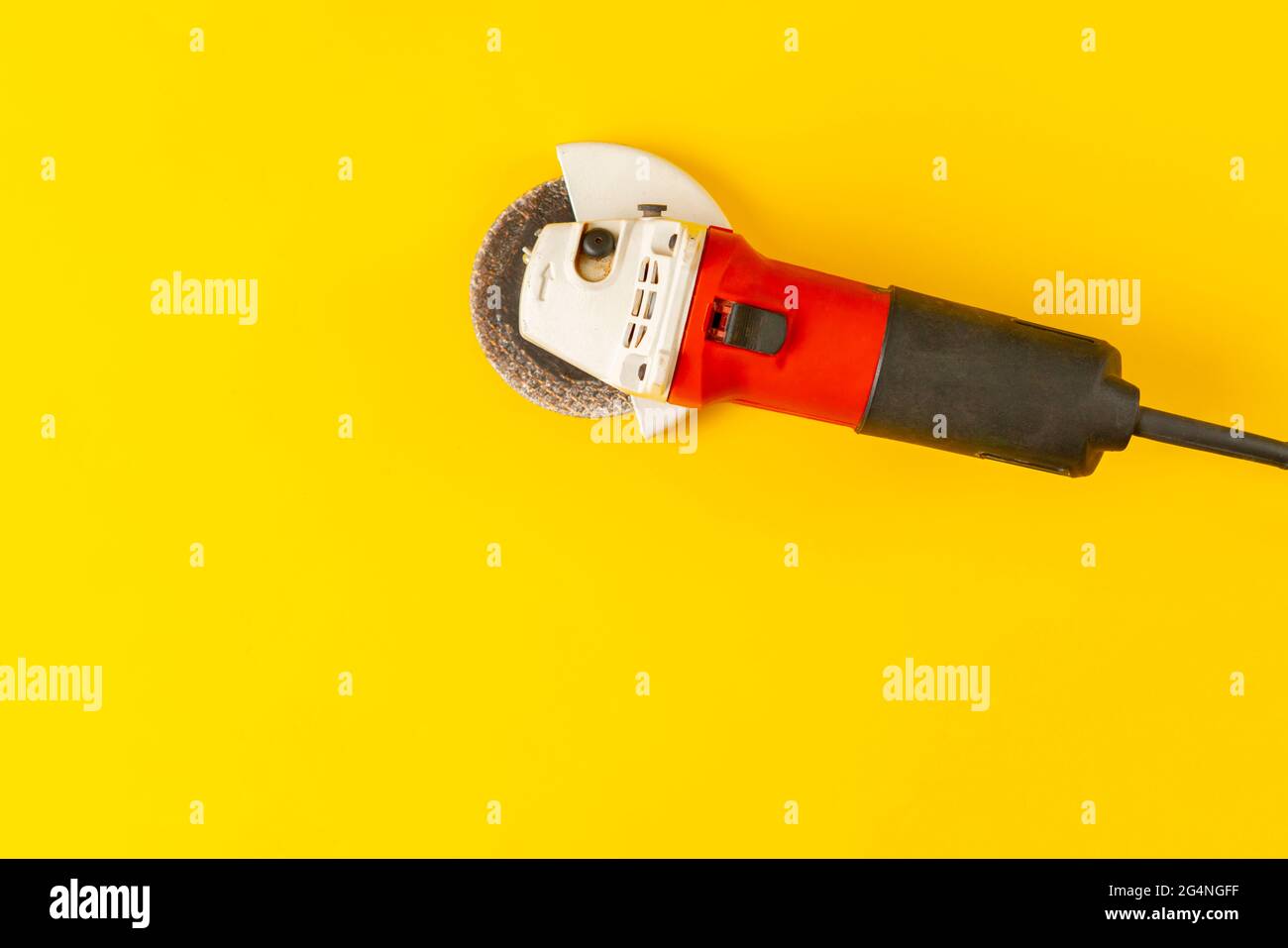 simple black and red angle grinder machine tool isolated against the ...