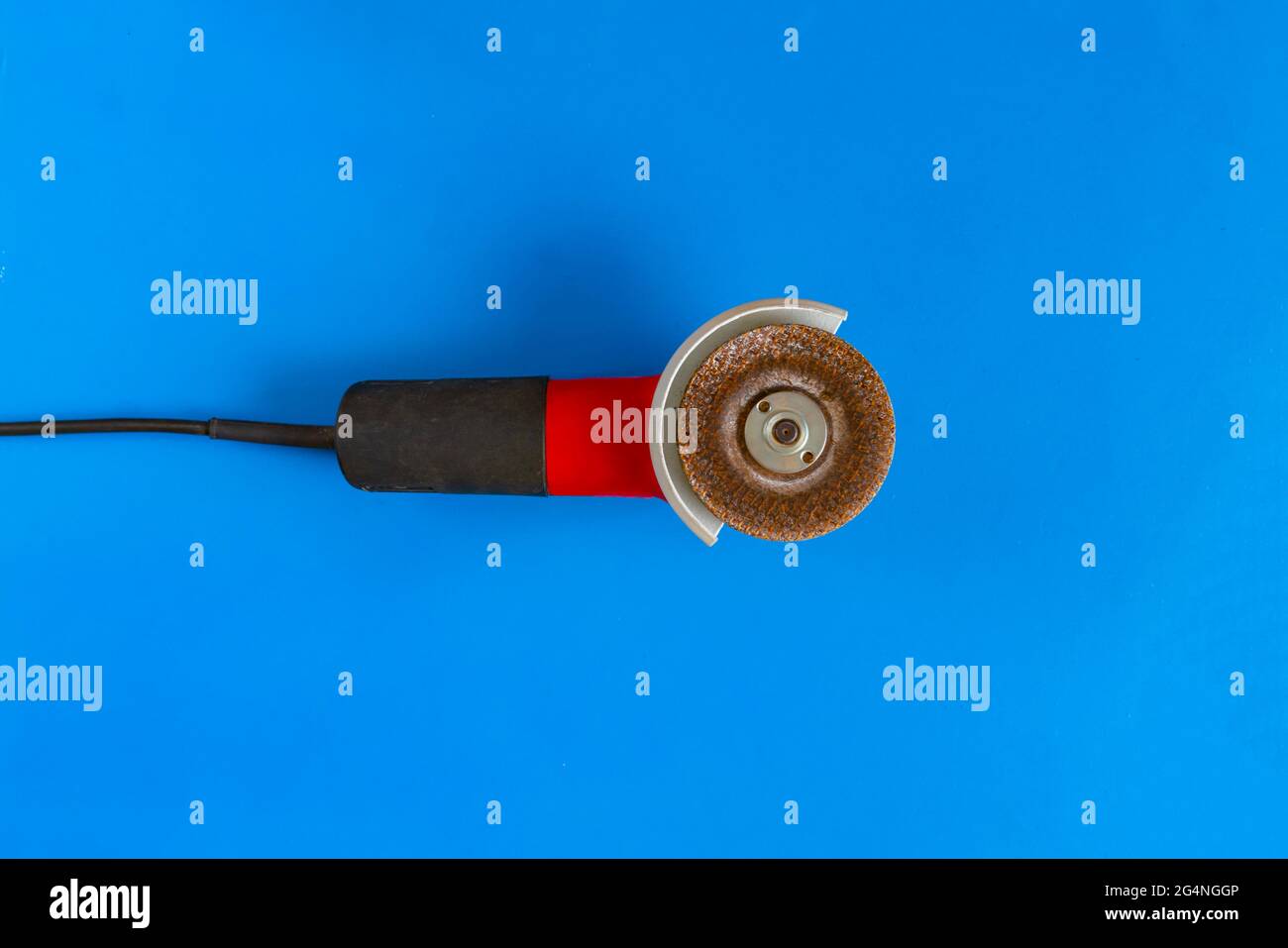 simple black and red angle grinder machine tool isolated against the ...