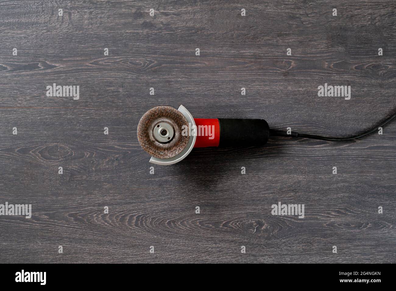 simple black and red angle grinder machine tool isolated against the ...