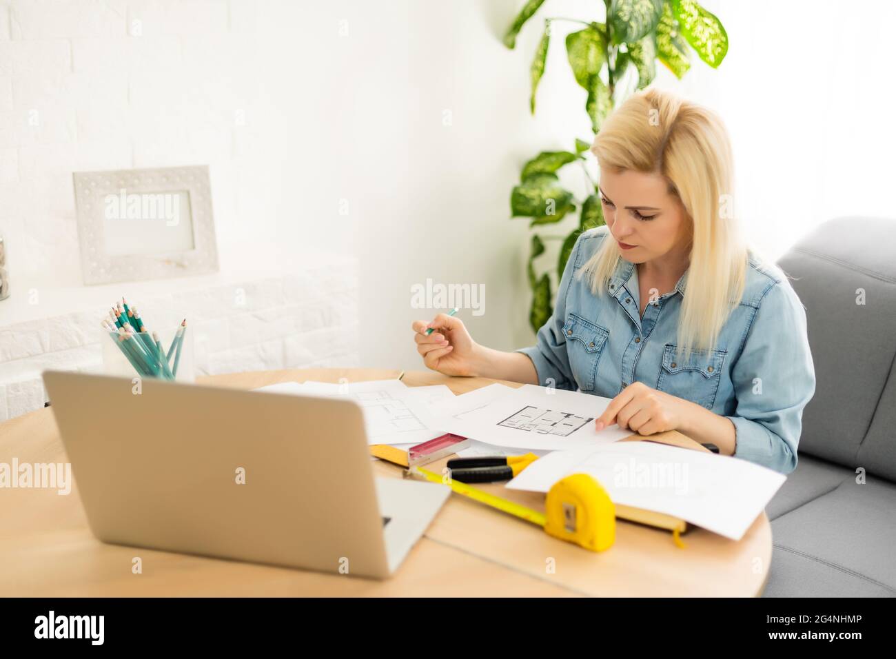 Architect working on blueprint. Architects workplace - architectural ...
