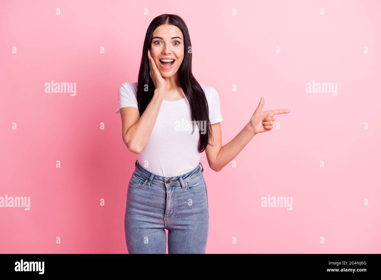 Photo Of Impressed Brunette Lady Point Empty Space Wear White T Shirt