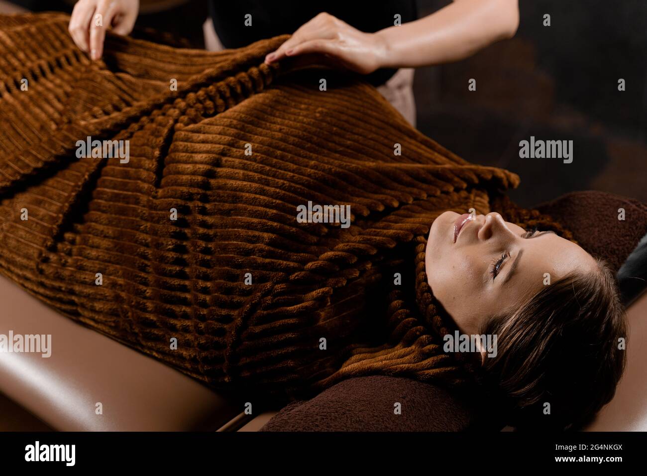 Full body wrap after chocolate massage. Beauty treatment for female ...