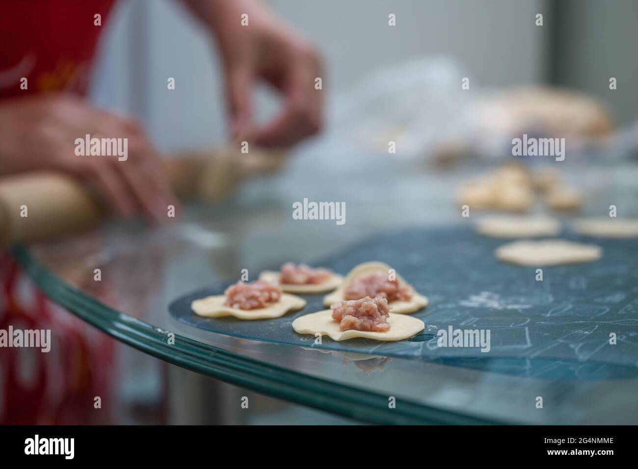 the process of making homemade dumplings in the kitchen Stock Photo - Alamy