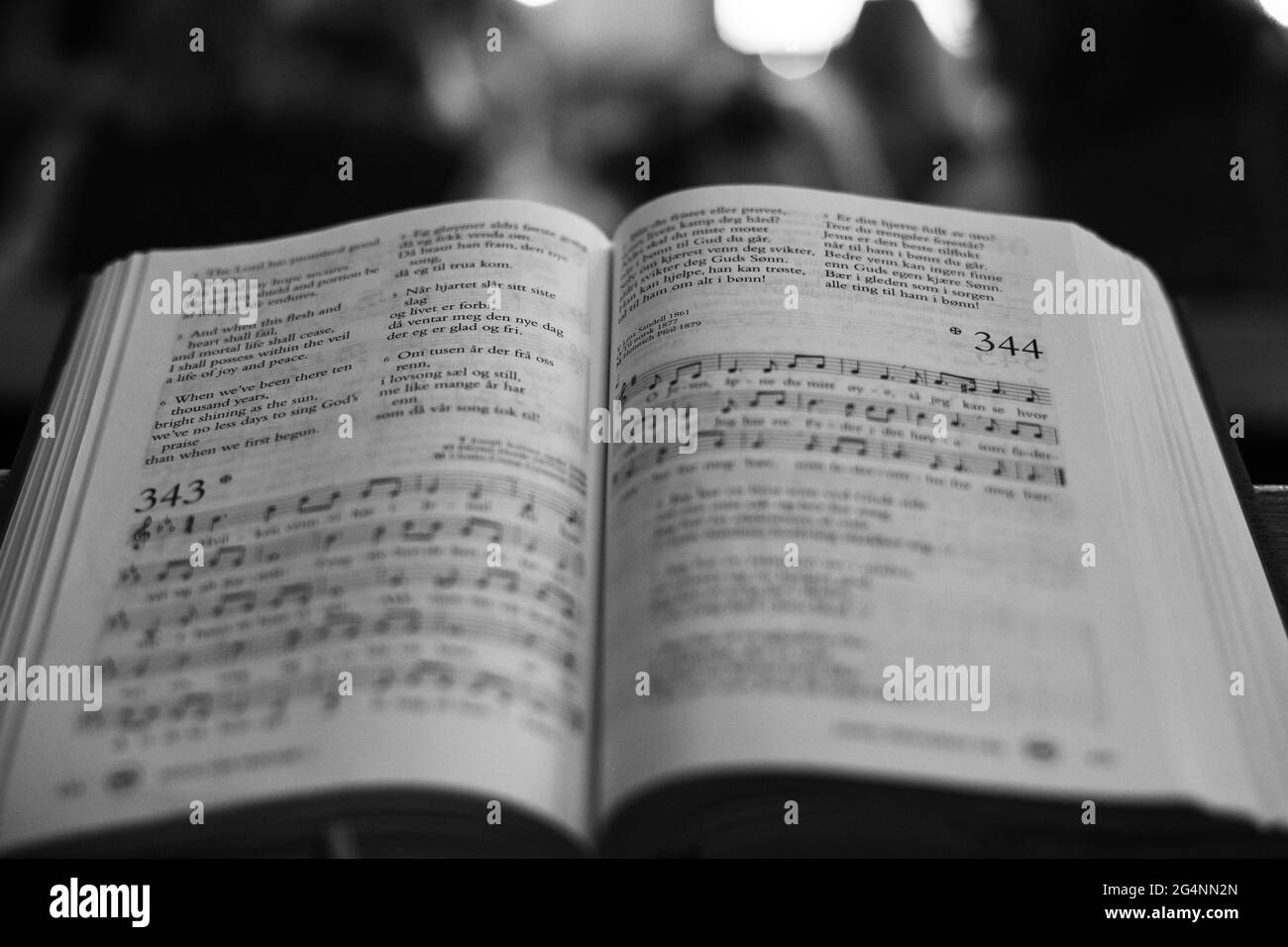 A grayscale shot of an opened book with musical text and notes Stock ...