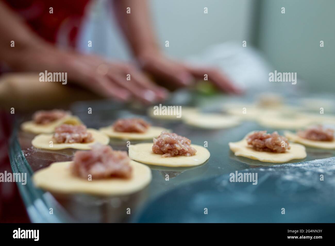 the process of making homemade dumplings in the kitchen Stock Photo - Alamy