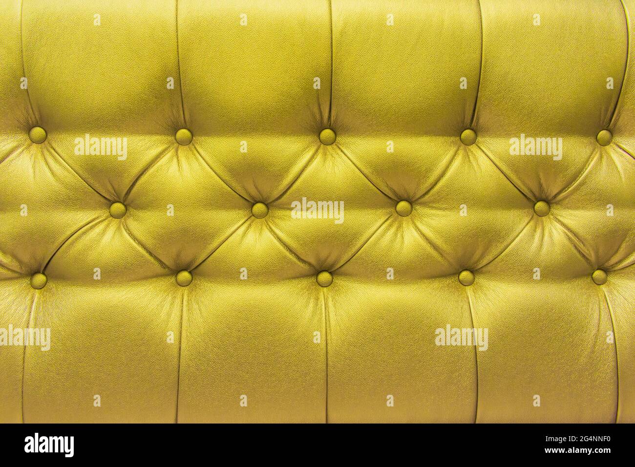 Yellow or gold leather upholstery sofa with pattern button design ...