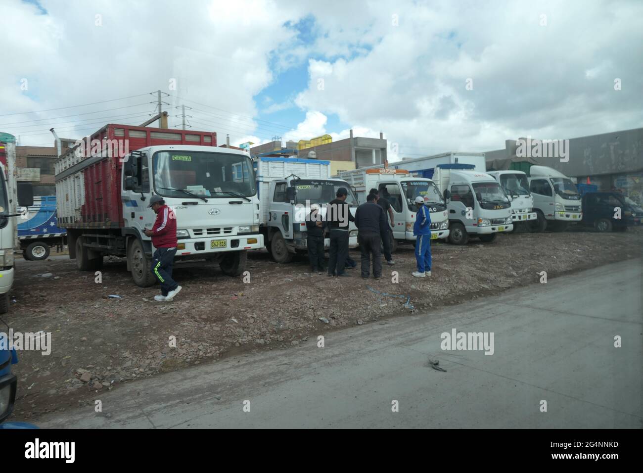 Lorries by the road in Peru parked parking park gravel old style ...