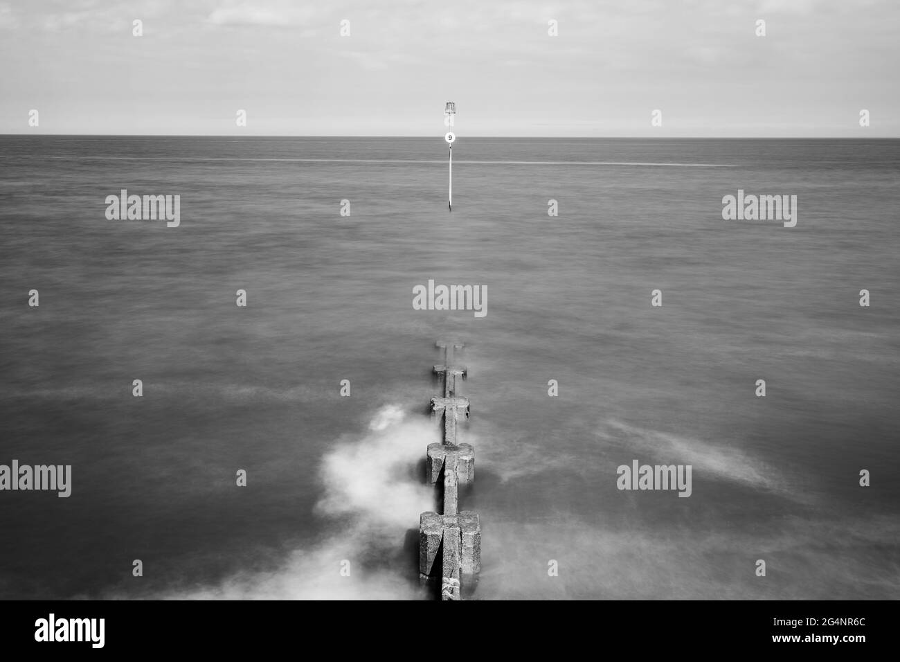 Groyne and tide marker at Hunstanton featuring the number nine label ...