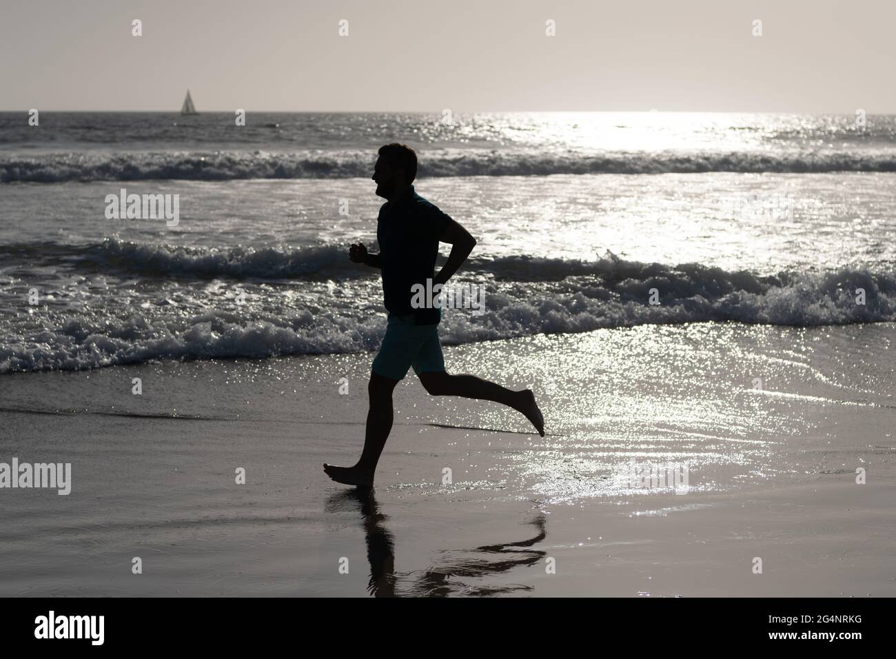 athlete run fast to win in the ocean. morning workout activity. healthy ...