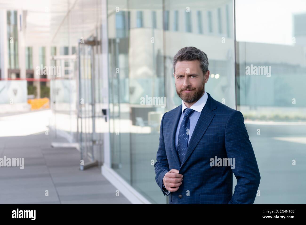 successful man boss in businesslike suit. manager outside the office ...