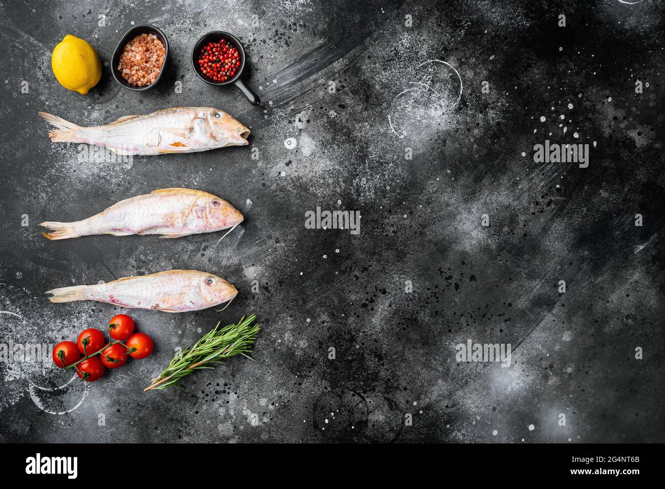 Raw surmullet whole seafood fish set, with ingredients and herbs, on ...