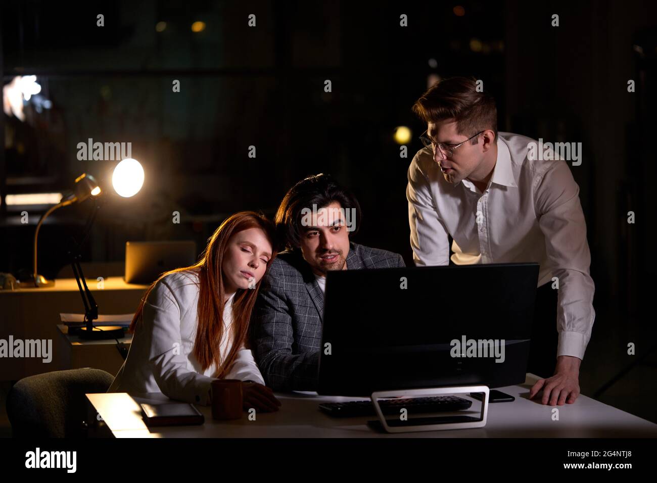 Group of young confident business colleagues in team discussing startup ...