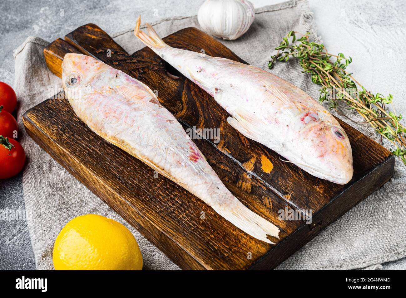 Raw fresh mullet or barabulka whole fish set, with ingredients and ...