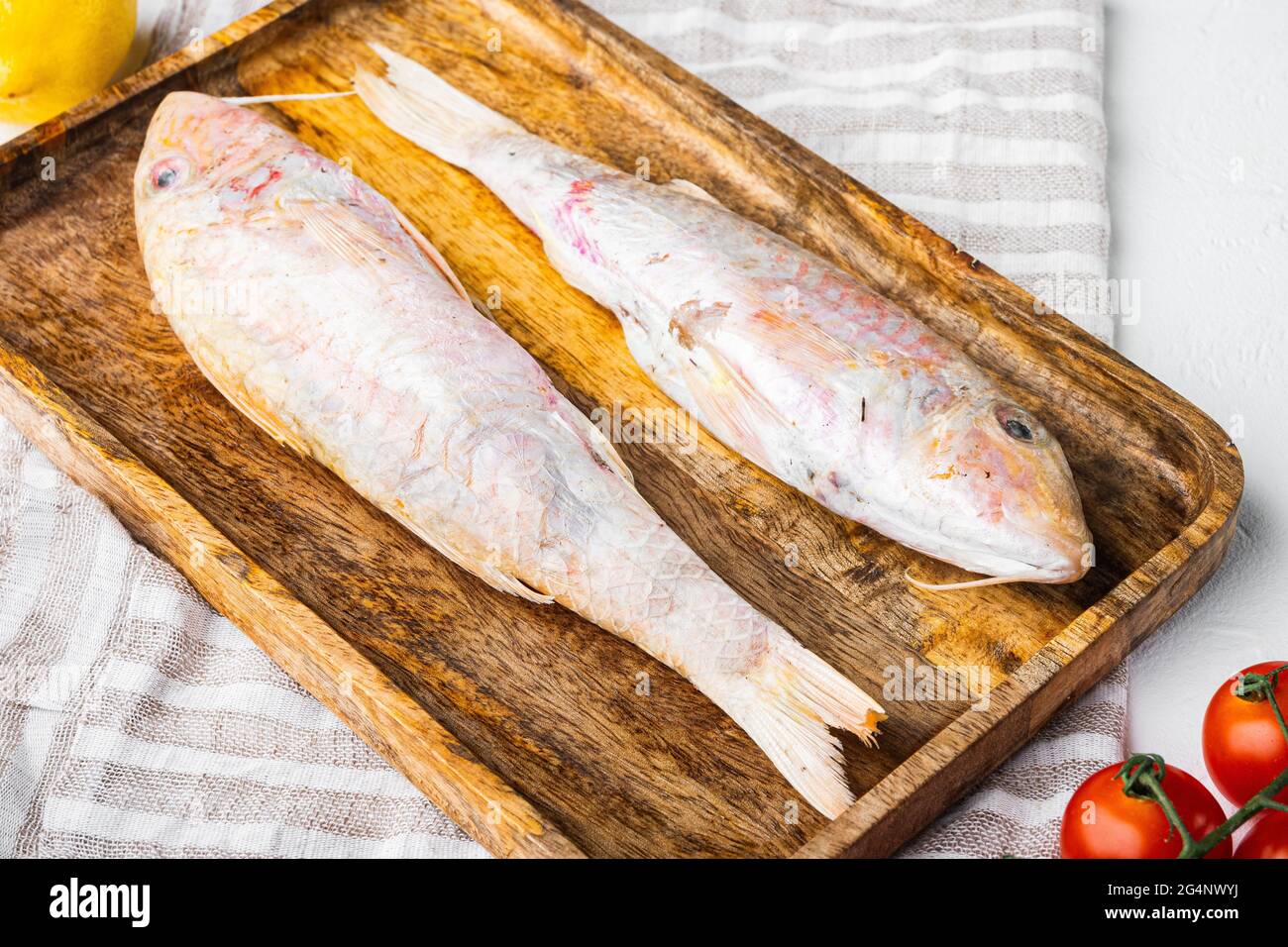 Raw Goatfish fresh whole fish set, with ingredients and herbs, on white ...