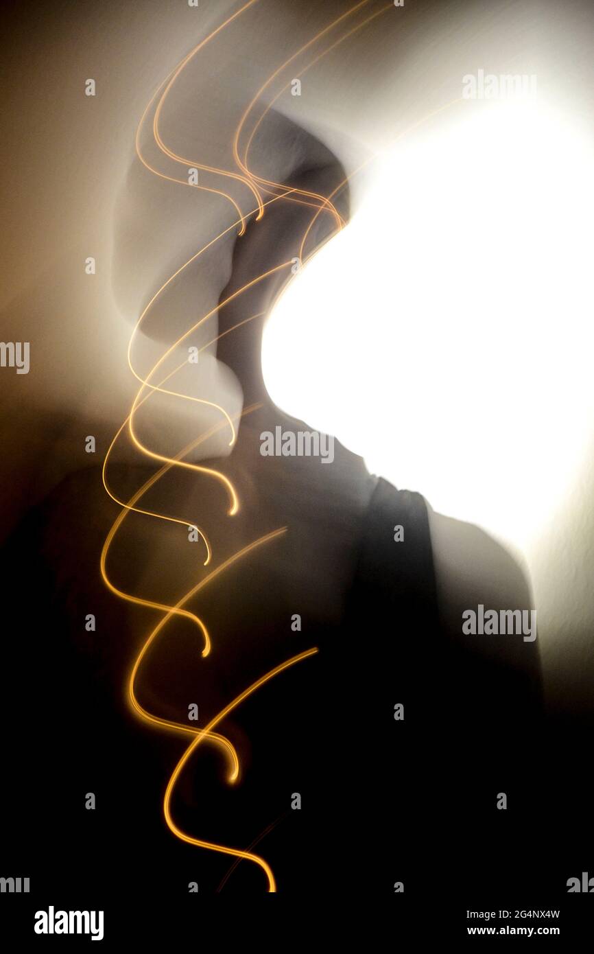 A slow shutter speed with light and the models movement Stock Photo - Alamy