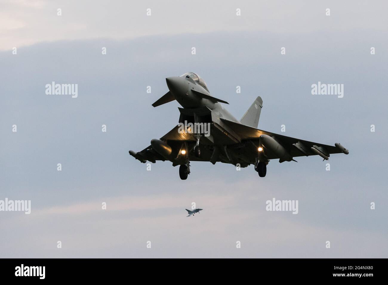 Two Royal Air Force Typhoon jets descend into RAF Coningsby in ...