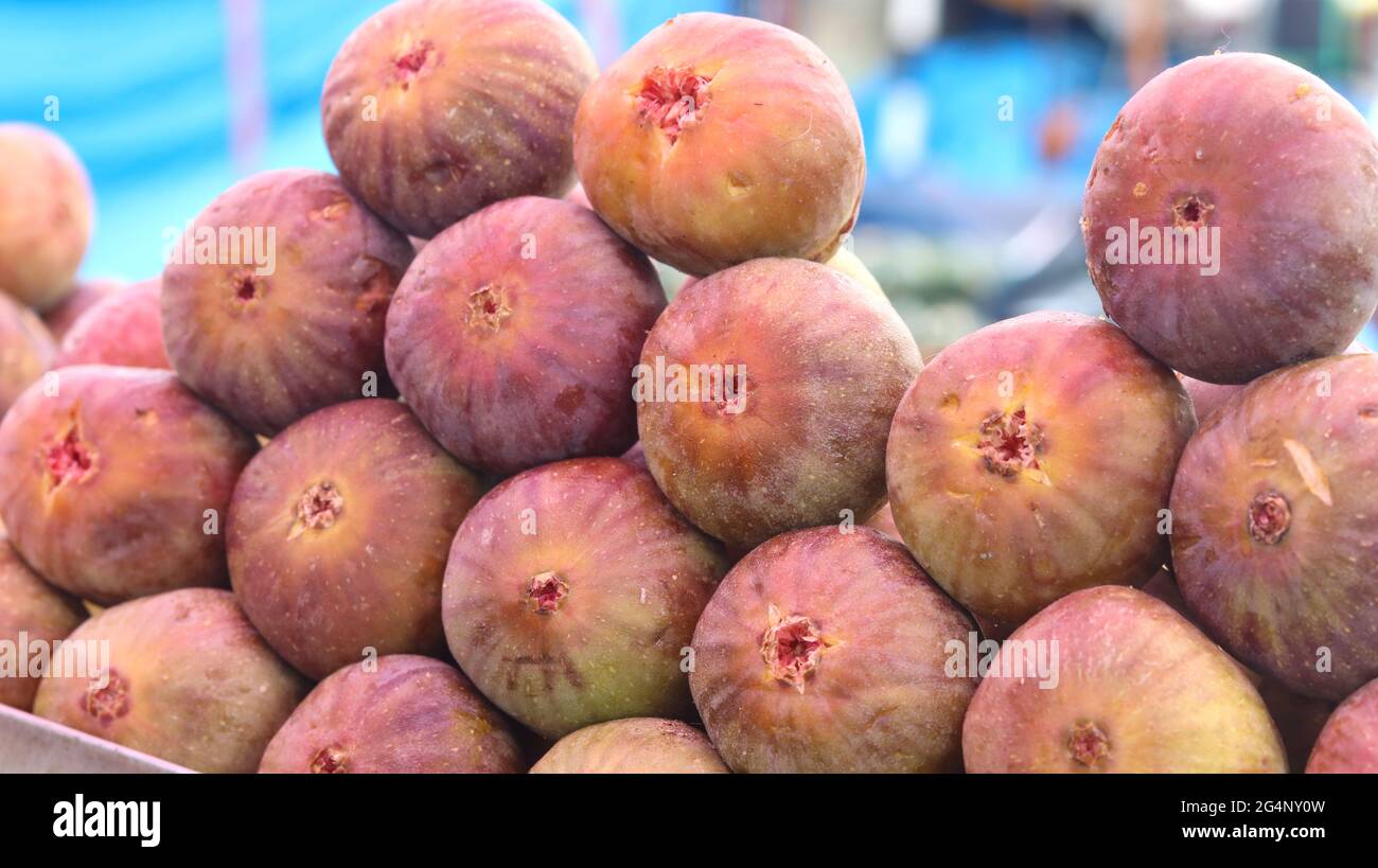 A closeup shot of a pile of figs at a market Stock Photo - Alamy