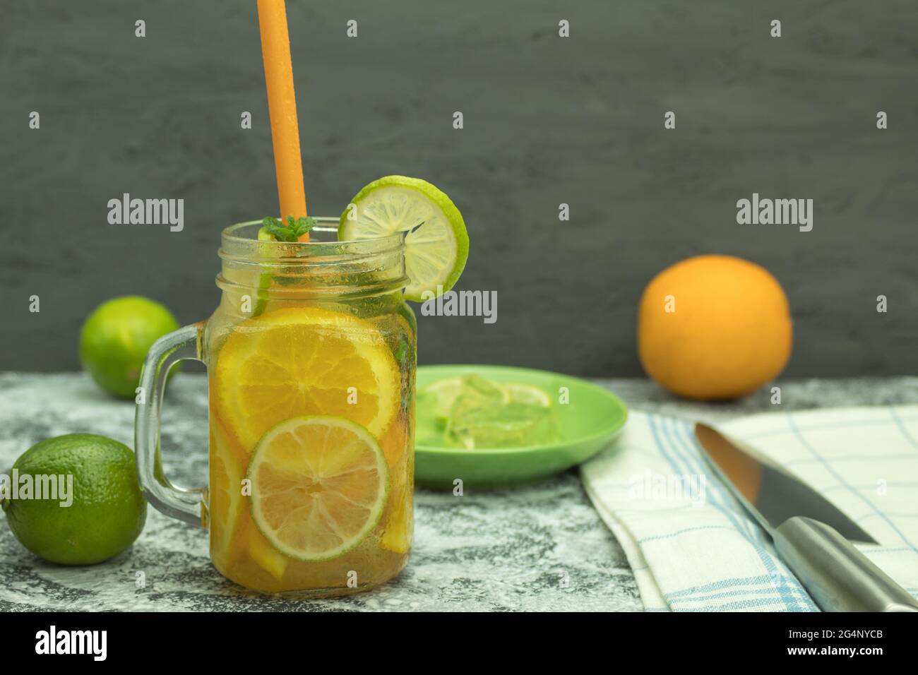 Cool lemonade made from orange and lime slices. Orange cocktail drink ...