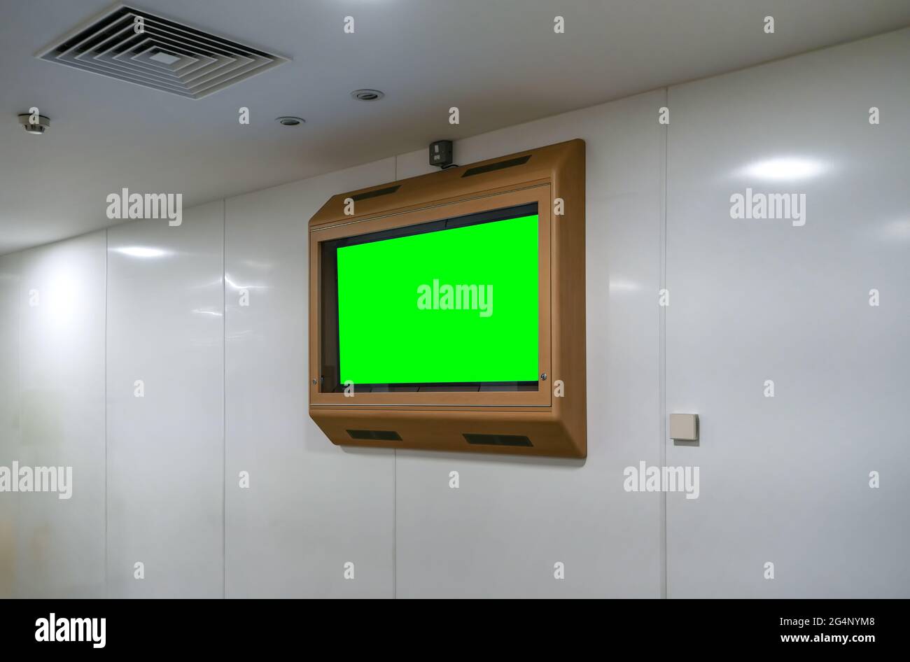 Wall mounted tv digital advertisement display, green mockup Stock Photo ...