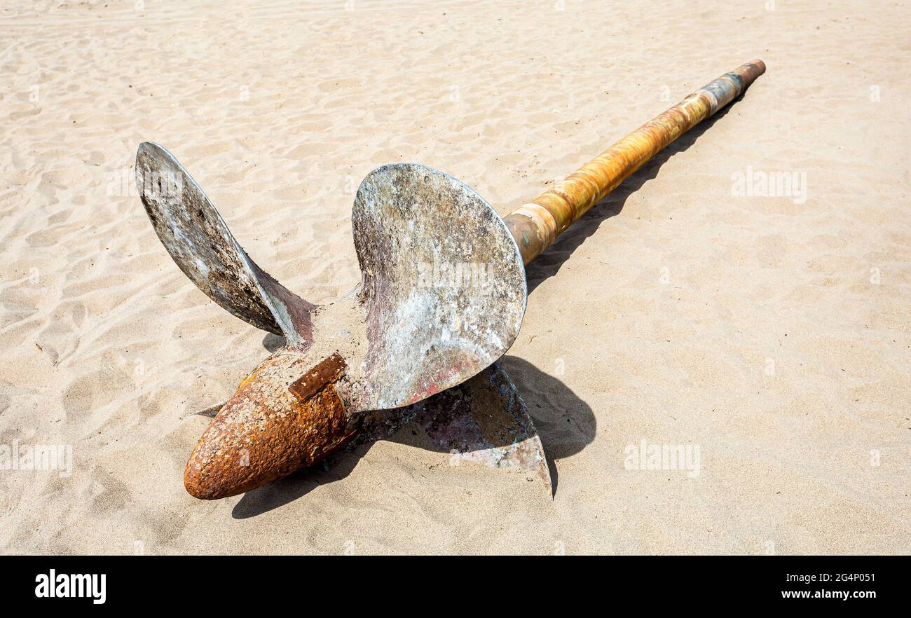 Old rusty ship propeller of a marine ship on the sand beach Stock Photo ...