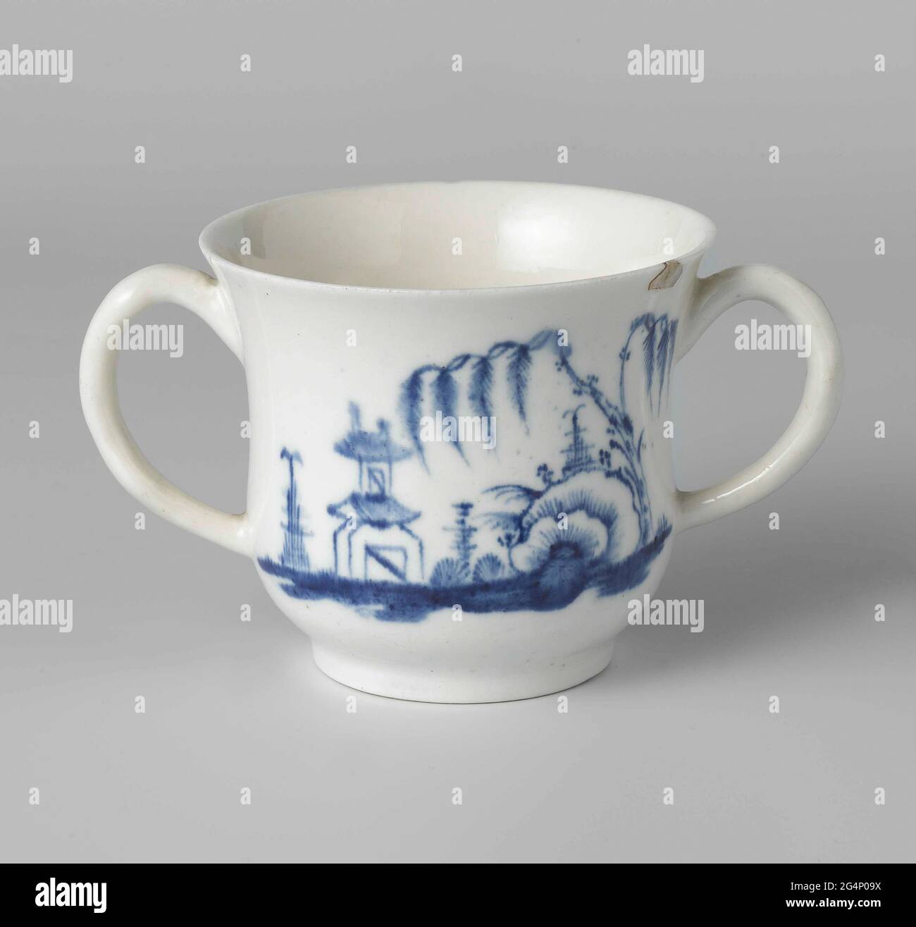 . Cup with two porcelain ears with decoration in blue. On both sides a ...