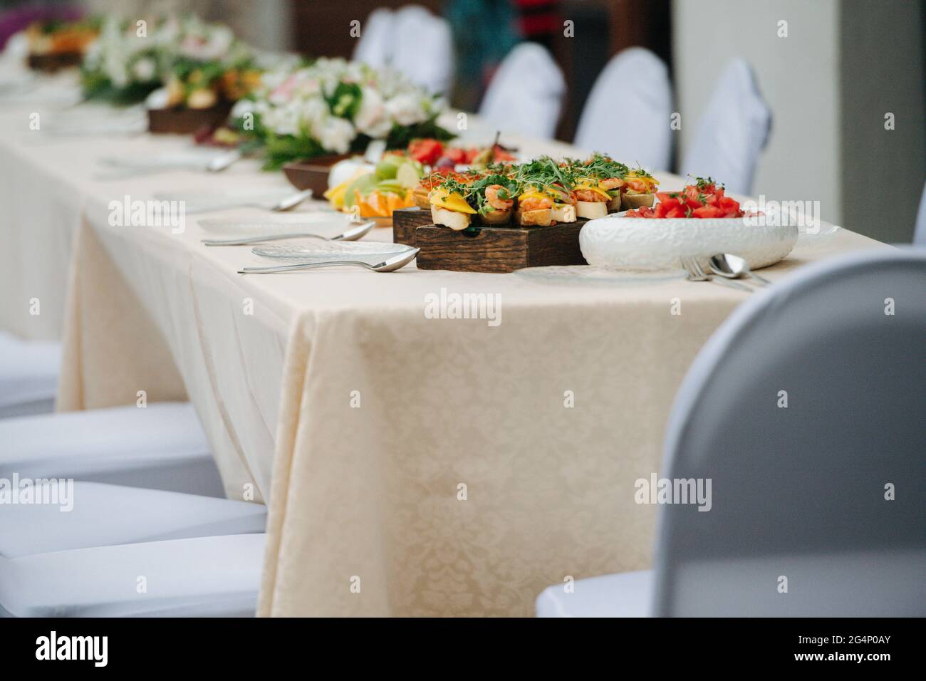 Beautifully laid dining table outdoors, abundant in the food. Dishes ...