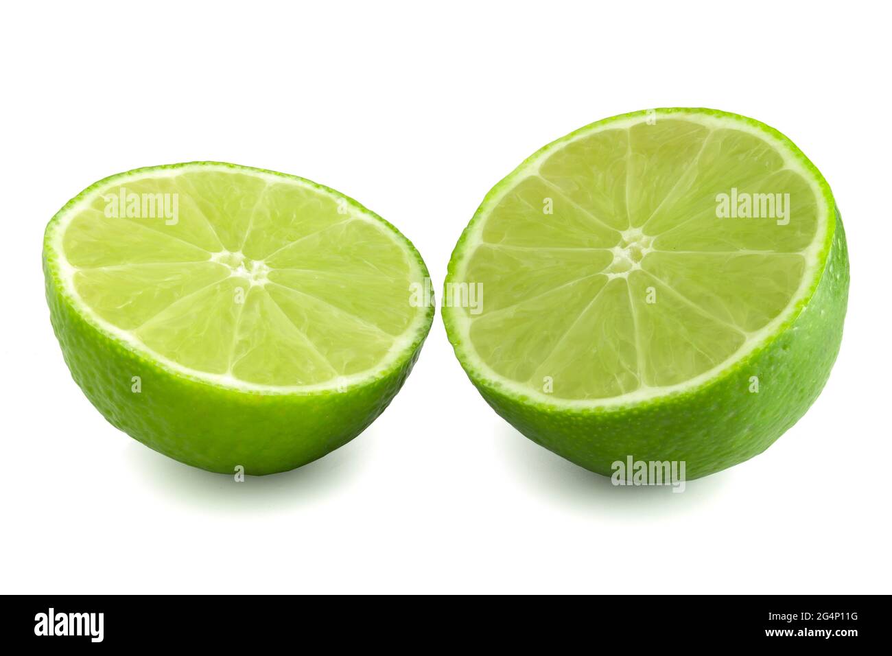 Two halves of lime isolated on white background. Fresh citrus cut in ...
