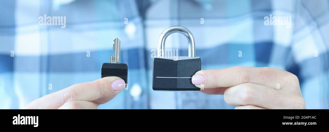 Human holds key and padlock on his hand Stock Photo - Alamy